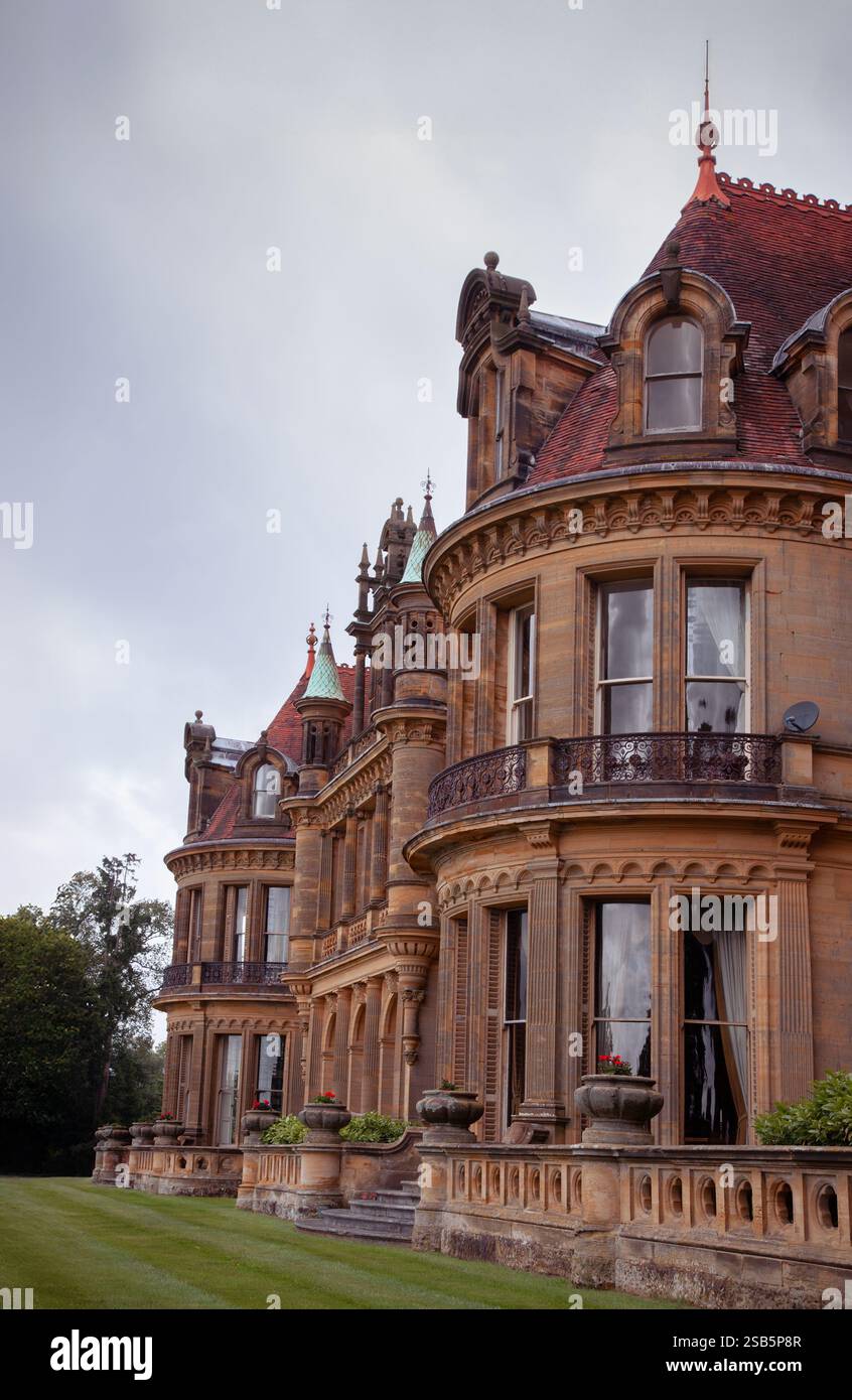 An imposing gothic style mansion situated in the countryside of England ...