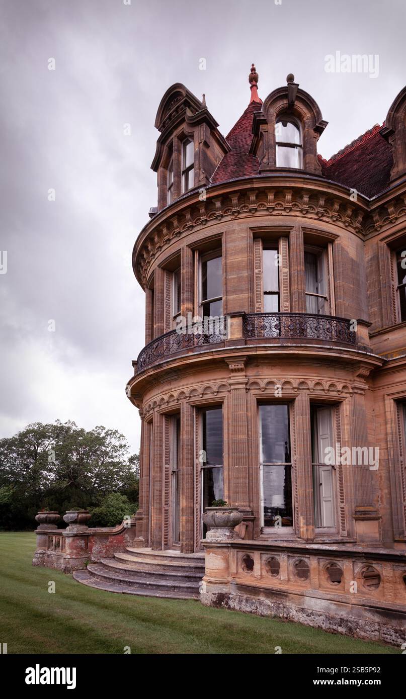 An imposing gothic style mansion situated in the countryside of England ...
