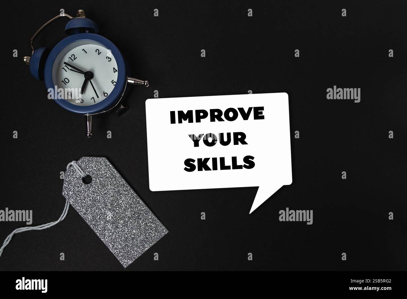 Blue alarm clock sits on a black background with the words improve your ...