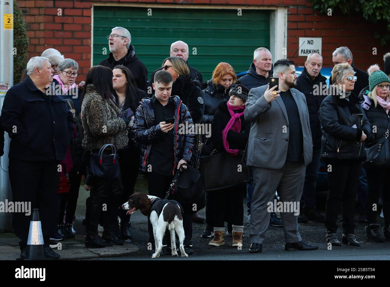 Bystanders watch on as people arrive for the Funeral of Linda Nolan at ...