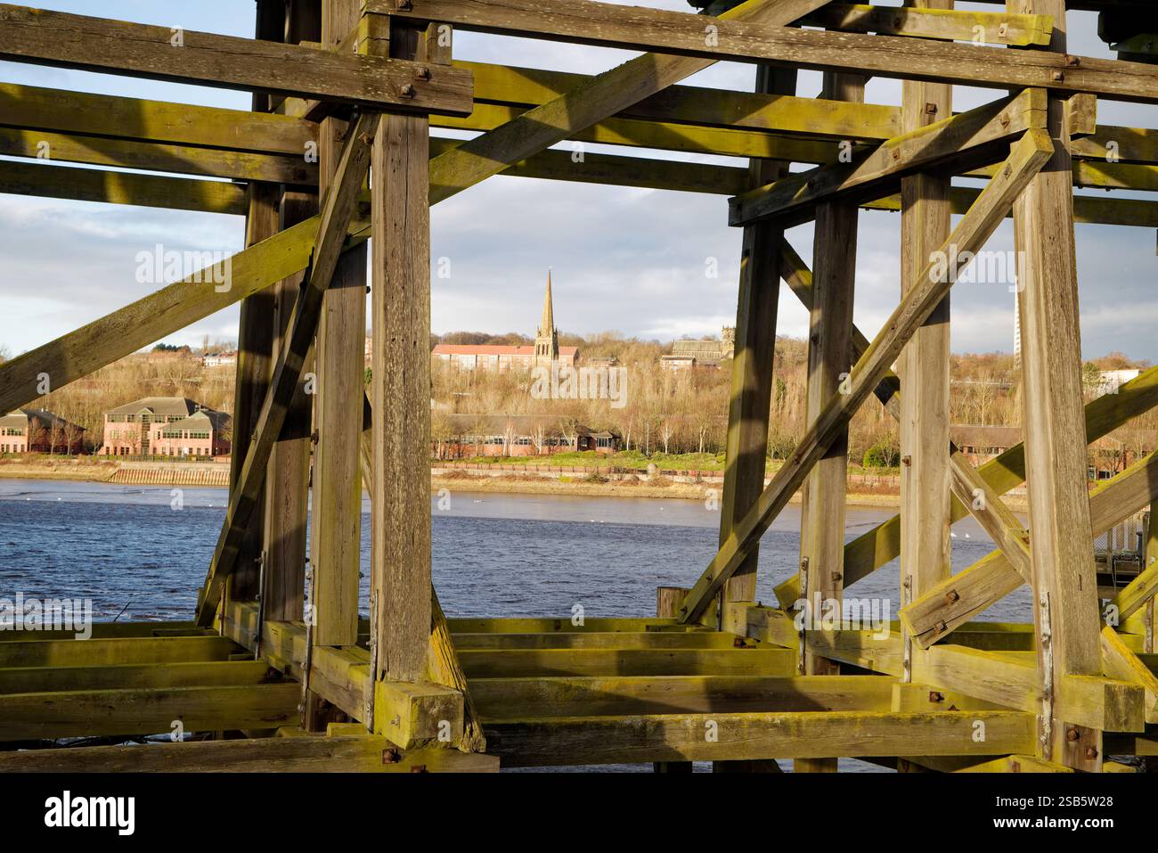 Elswick riverside viewed through the wooden trestle structure of the ...