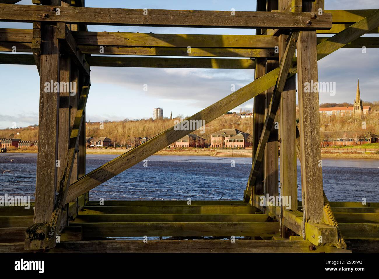 Elswick riverside viewed through the wooden trestle structure of the ...