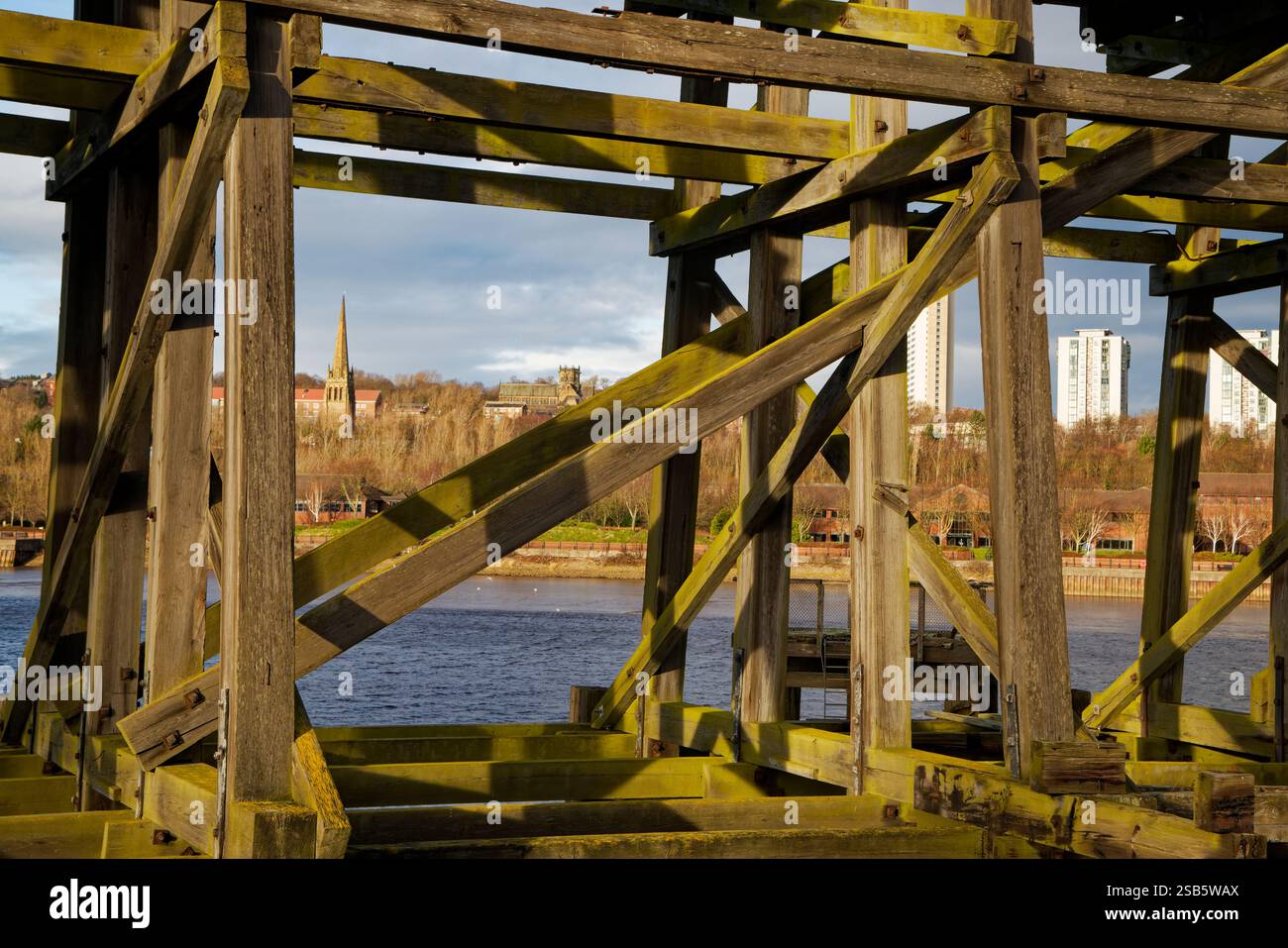 Elswick riverside viewed through the wooden trestle structure of the ...