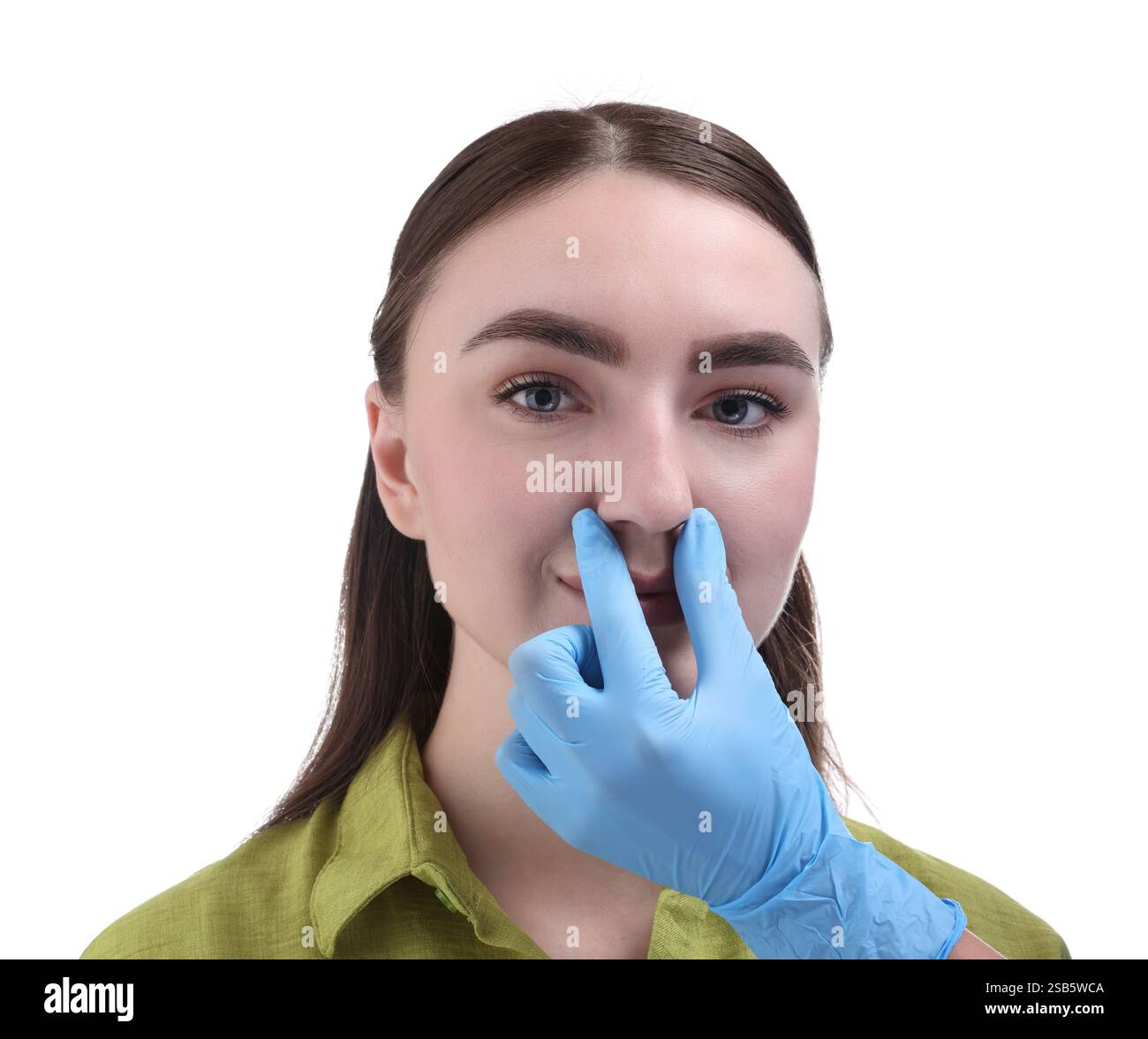 Doctor checking patient's nose before plastic surgery operation on ...