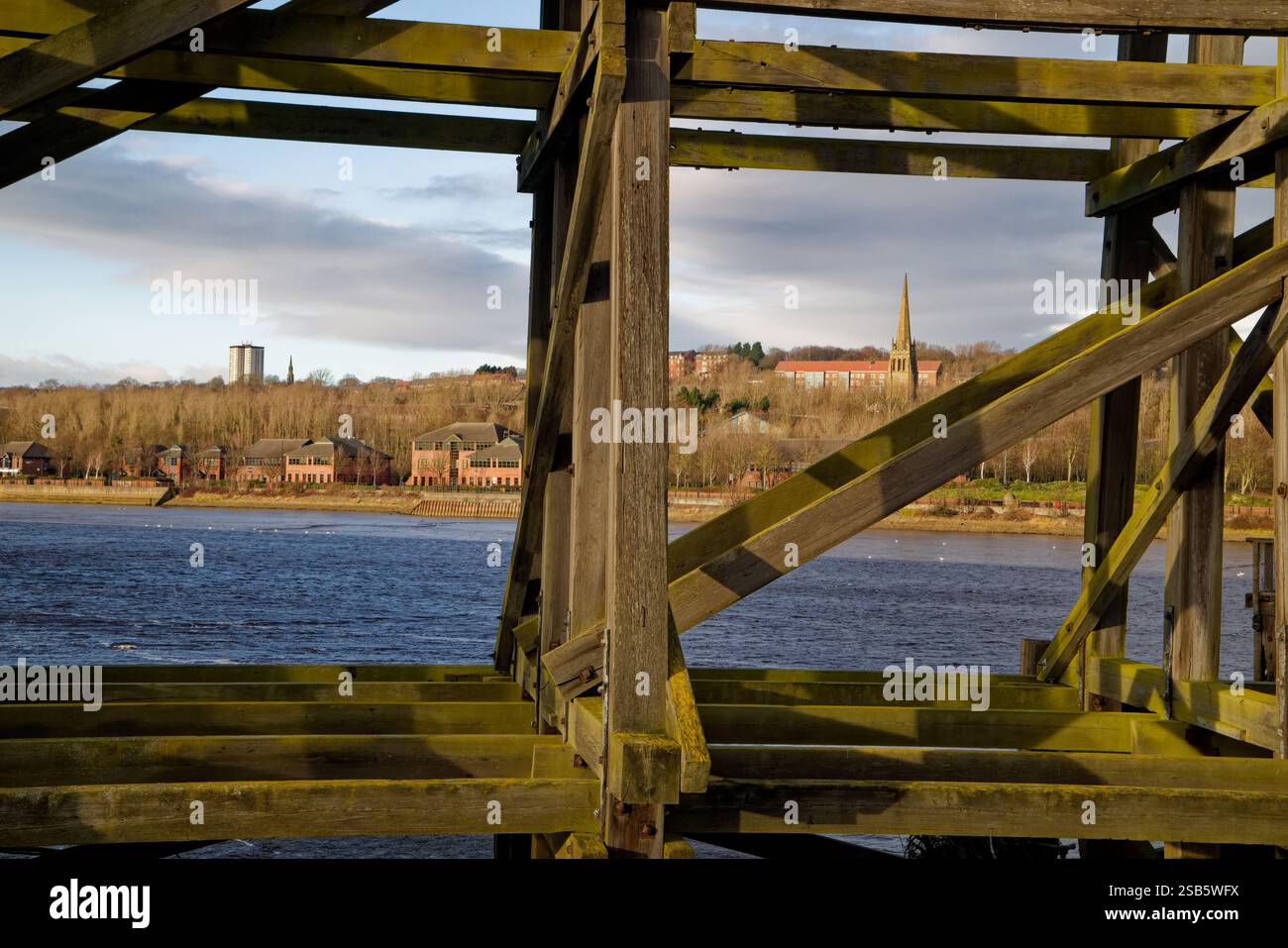 Elswick riverside viewed through the wooden trestle structure of the ...