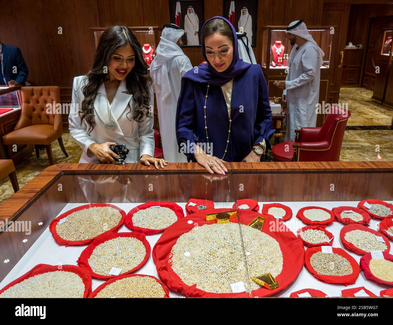 Doha. 31st Jan, 2025. Visitors look at a collection of pearls at the ...