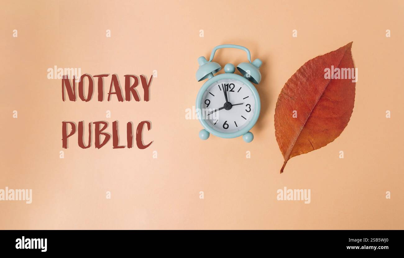 Blue alarm clock with the hands on the numbers 12 and 6. The clock is ...