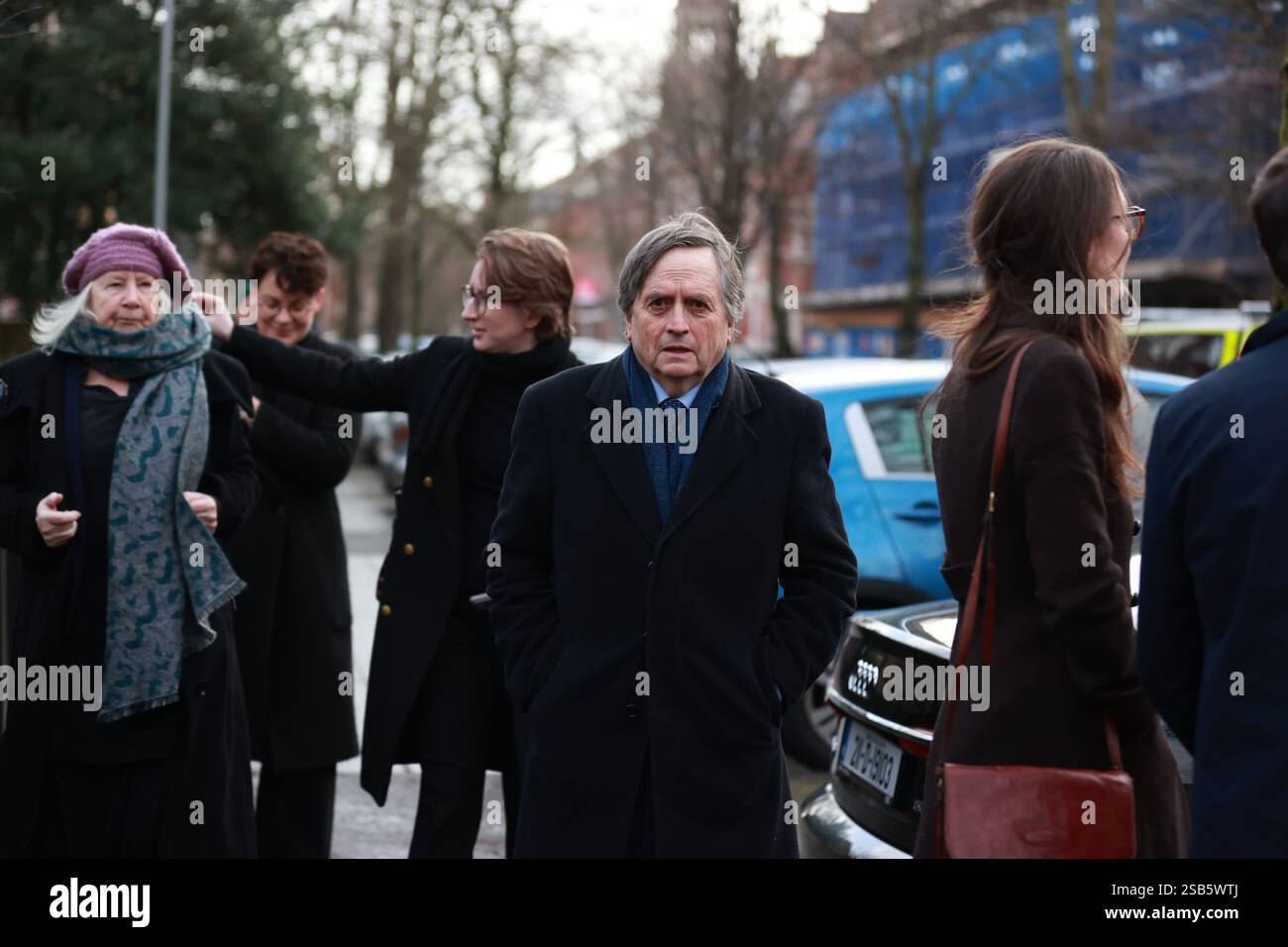 Historian Brian Walker (centre) arrives for the funeral of acclaimed ...