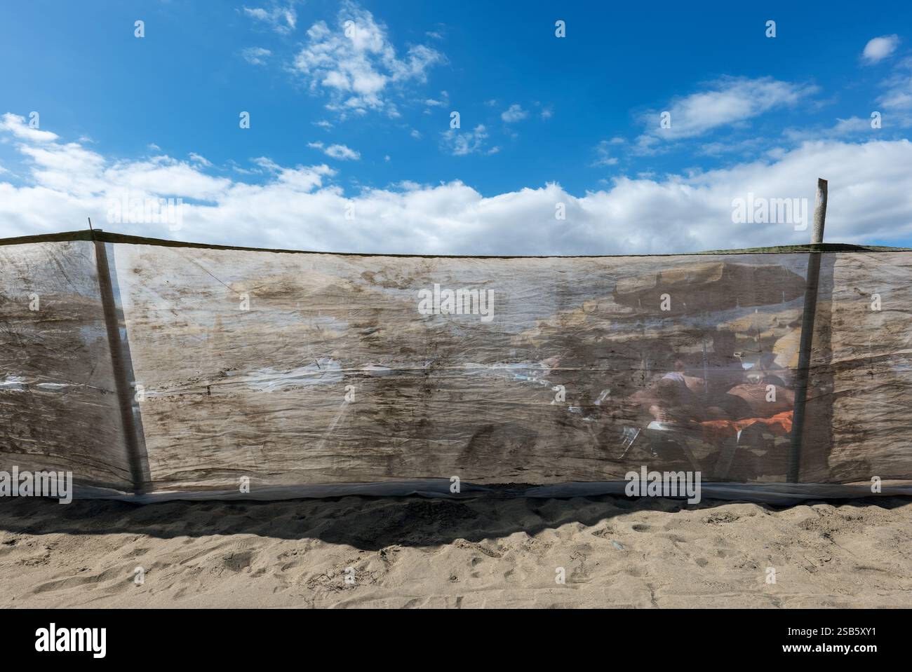 A stretched net for sand and wind protection on Maspalomas beach in ...