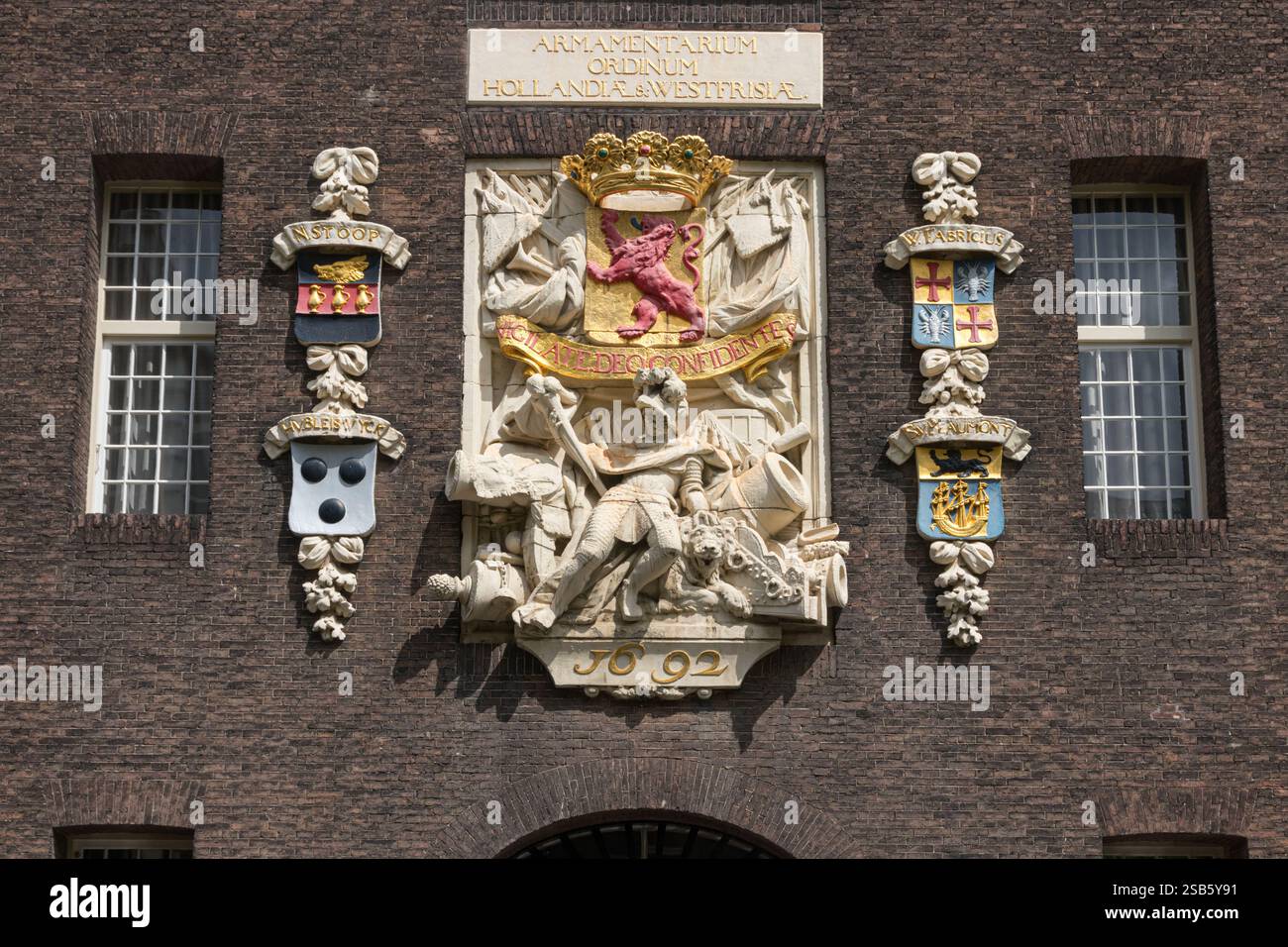 Coat of arms on the wall of the Delft arsenal. Delft, South-Holland ...