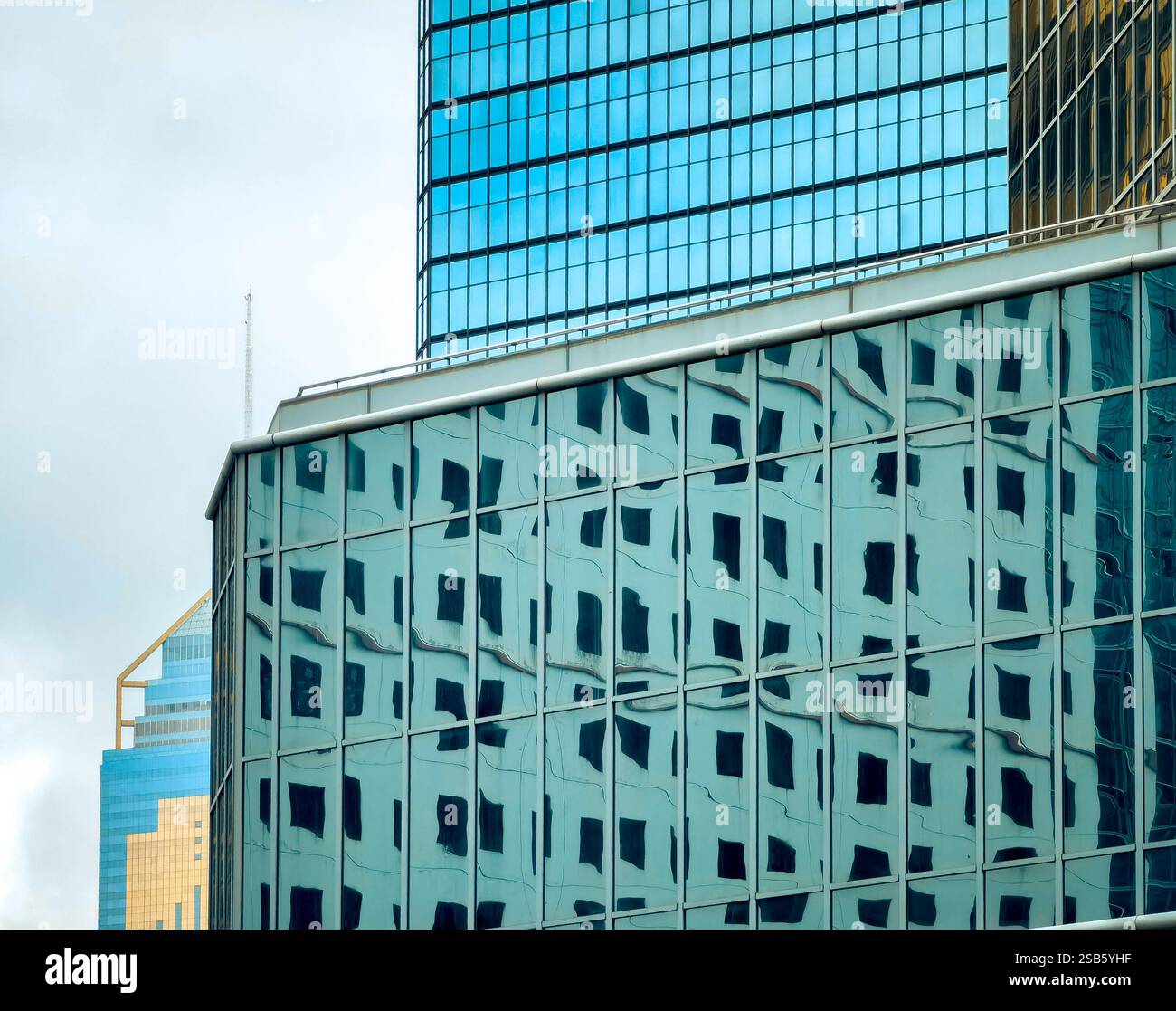 Close-up view of modern glass buildings in Hong Kong, reflecting the ...