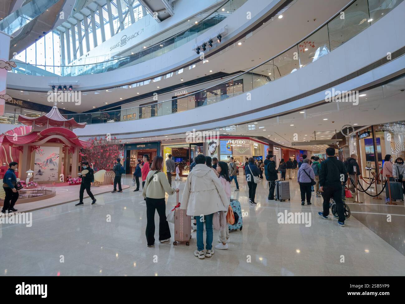 Hong Kong, China - February 01, 2025 : A bustling shopping mall atrium ...