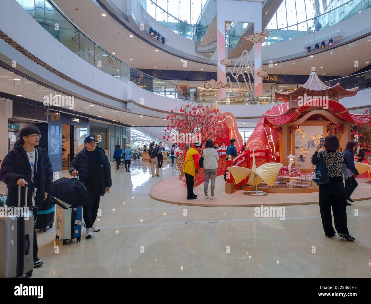 Hong Kong, China - February 01, 2025 : A bustling shopping mall atrium ...