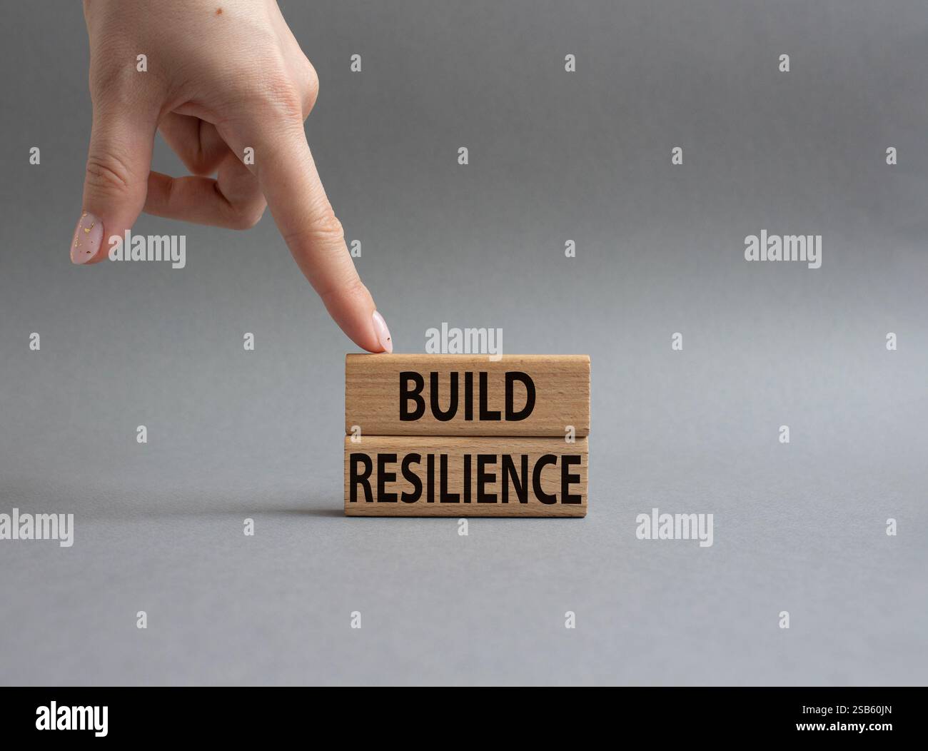 Build resilience symbol. Wooden blocks with words Build resilience ...