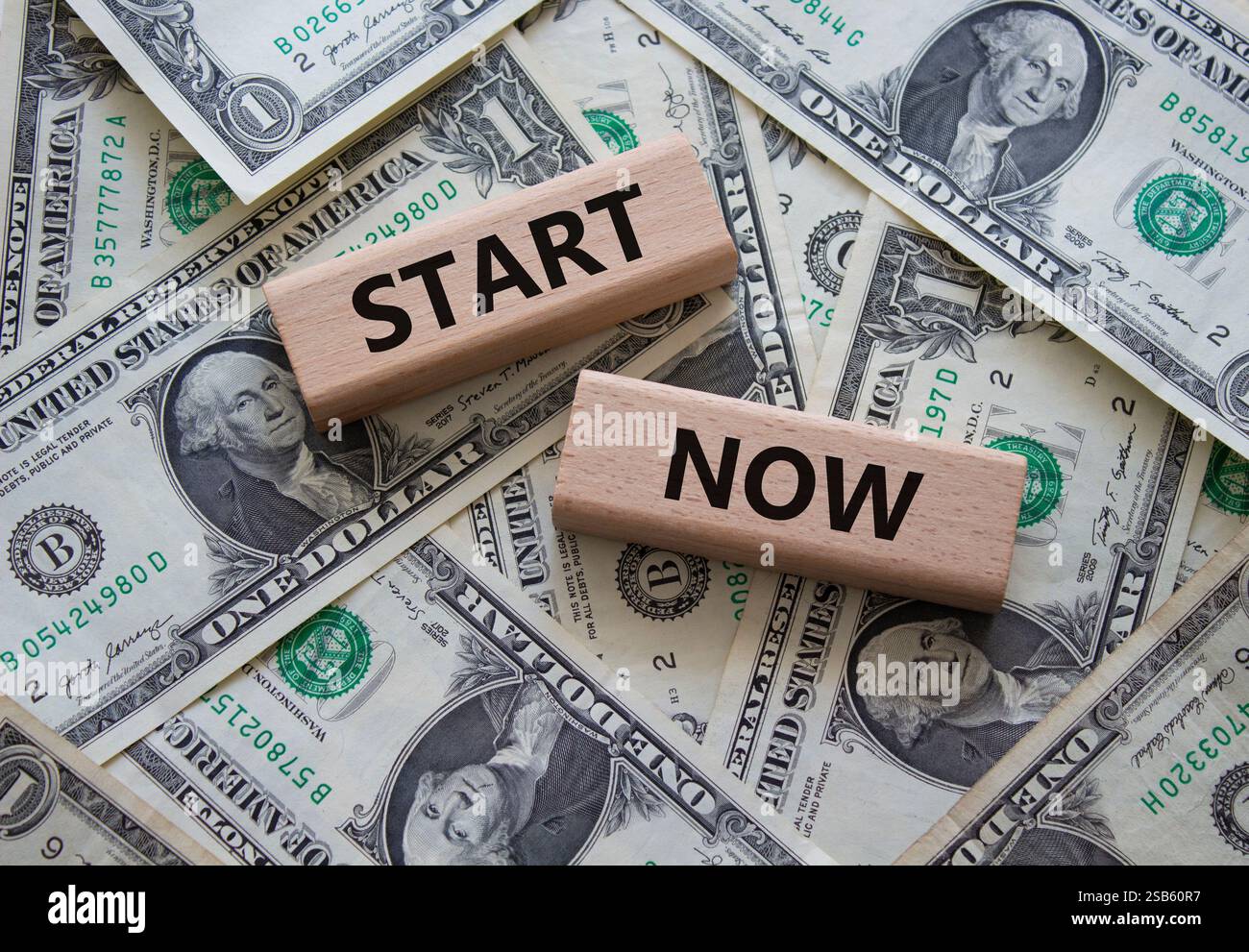 Start now symbol. Wooden blocks with words Start now. Beautiful dollar ...