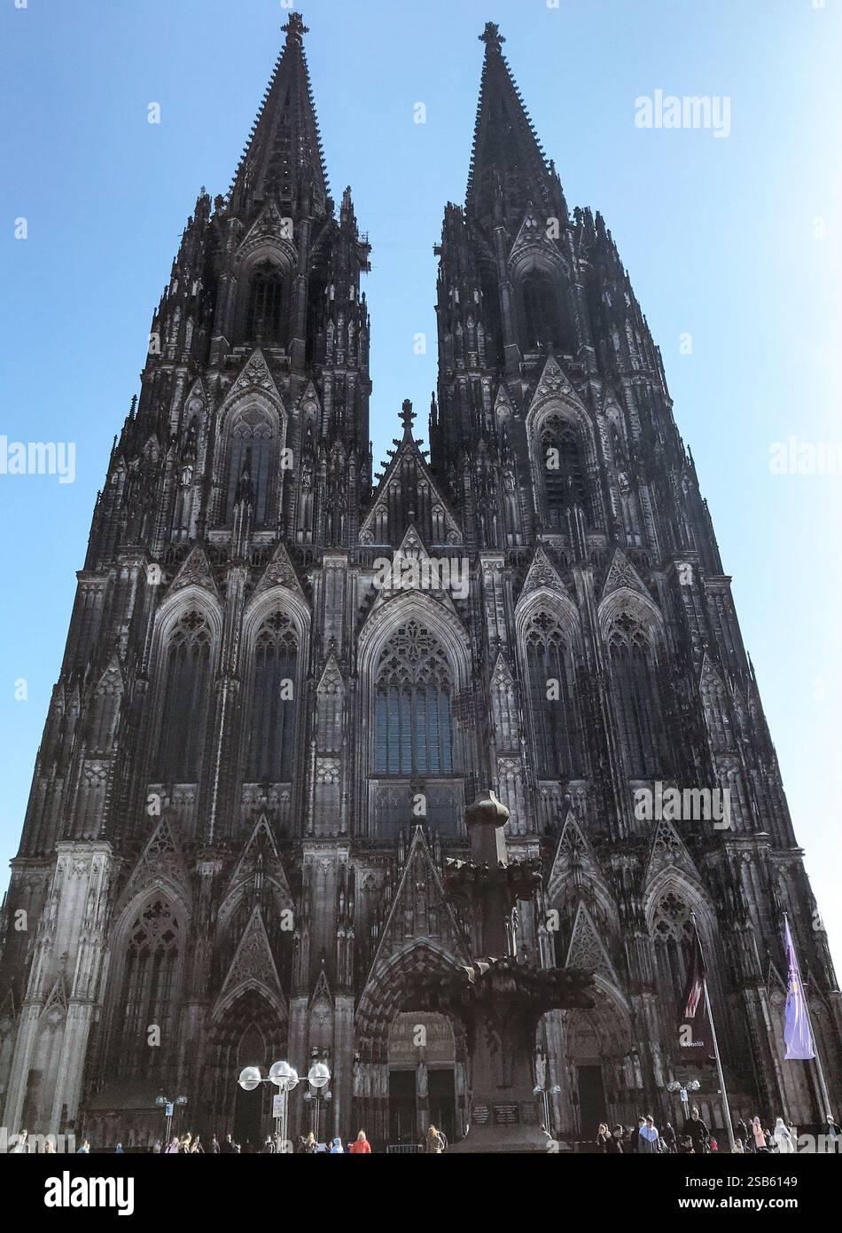 Cathedral in Cologne. The two tall towers of a cathedral are lit up by ...