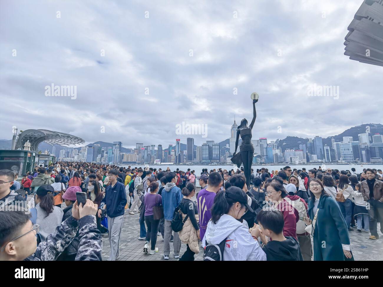 Hong Kong, China - February 01, 2025 : A bustling crowd enjoys the Tsim ...