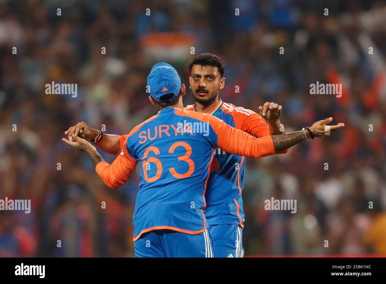 PUNE, INDIA - JANUARY 31: Axar Patel of India and Suryakumar Yadav captain of India (L ...