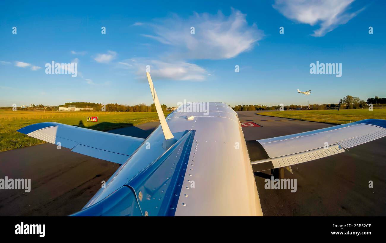 A small general aviation aircraft, its pre-takeoff checklist complete ...