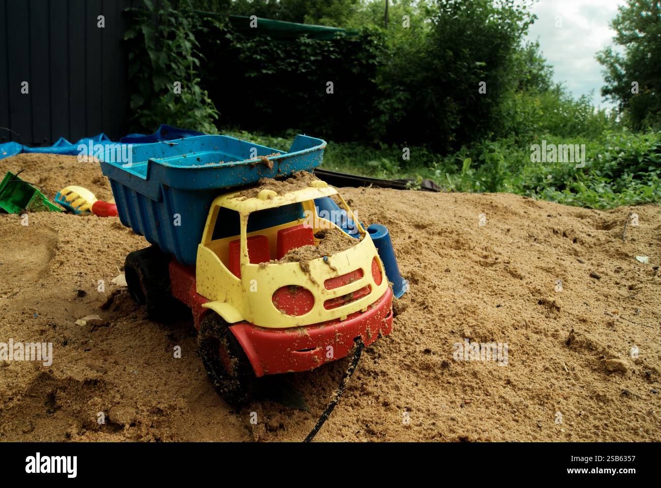 Toy Dump Truck in Sandbox Stock Photo - Alamy