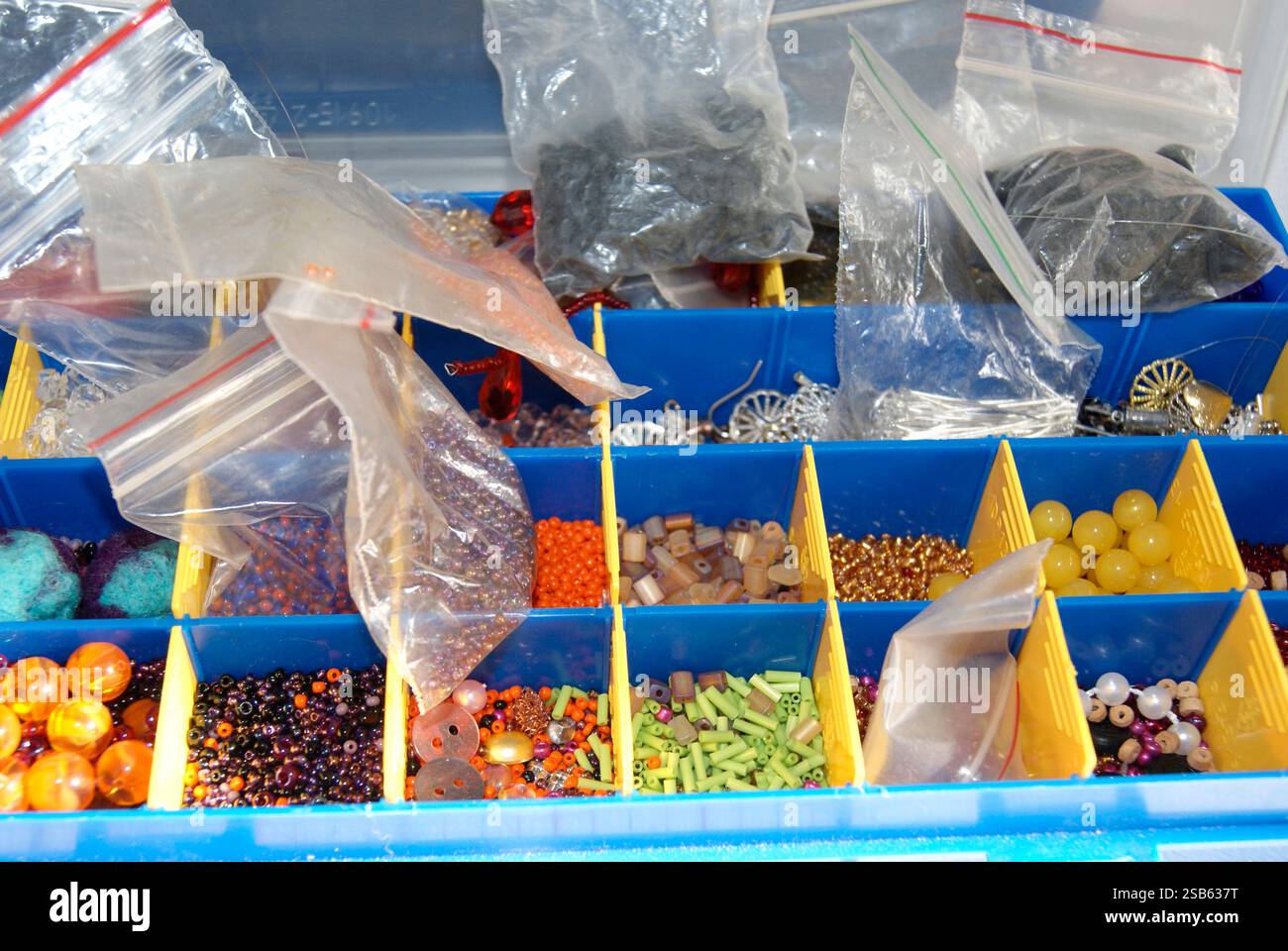 A blue bin overflowing with an assortment of different foods, including ...