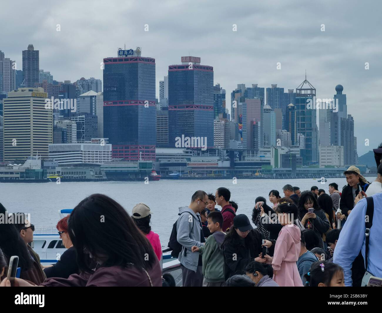 Hong Kong, China - February 01, 2025 : A bustling crowd of tourists ... Hong Kong, China - February 01, 2025 : A bustling crowd of tourists ...