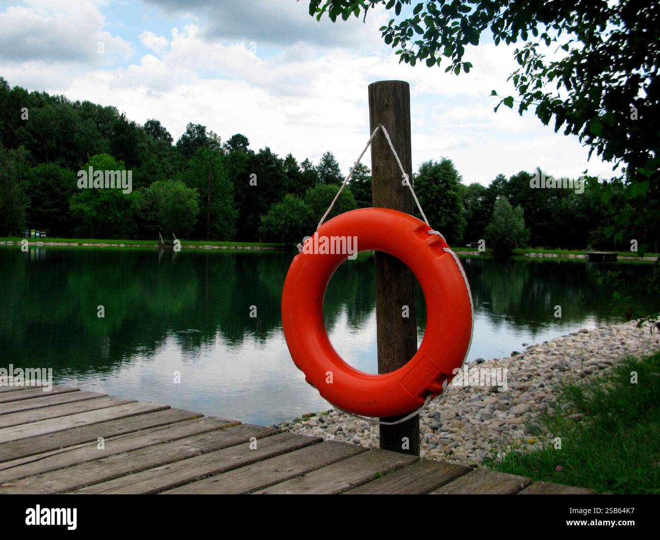 life belt with warning sign on risks and hazards in seafaring and ...