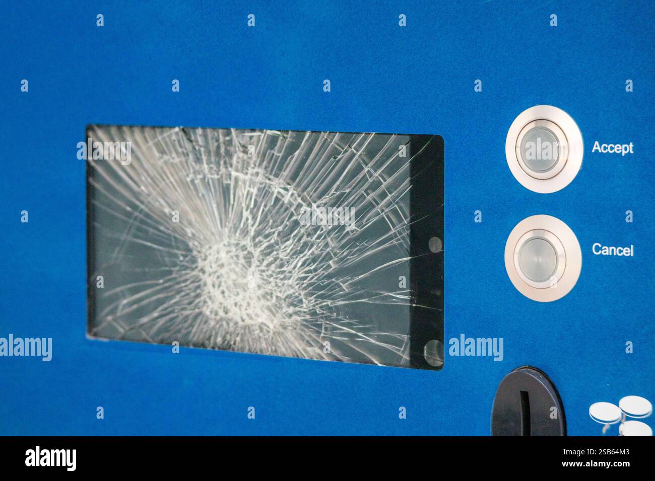 a machine with a broken screen. The screen is covered with cracks and ...