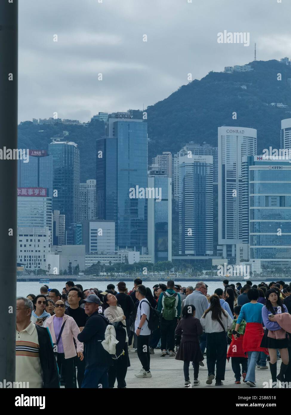 Hong Kong, China - February 01, 2025 : A bustling Tsim Sha Tsui Promenade during Chinese New ...