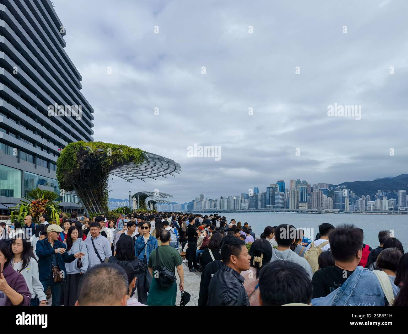 Hong Kong, China - February 01, 2025 : A bustling crowd enjoys the Tsim ...