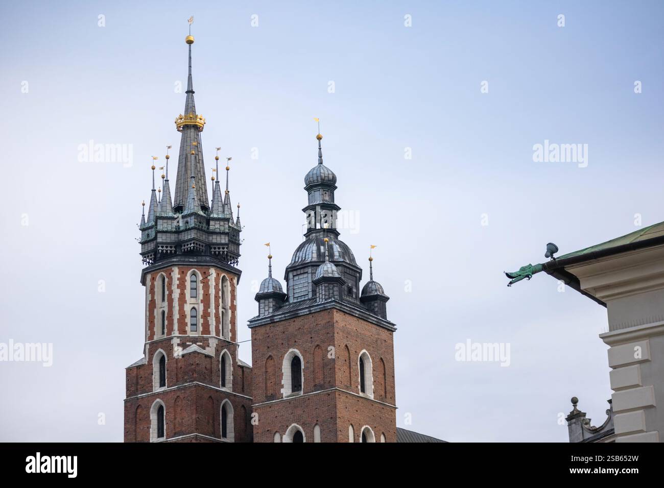 two imposing church towers towering against the blue sky Stock Photo ...