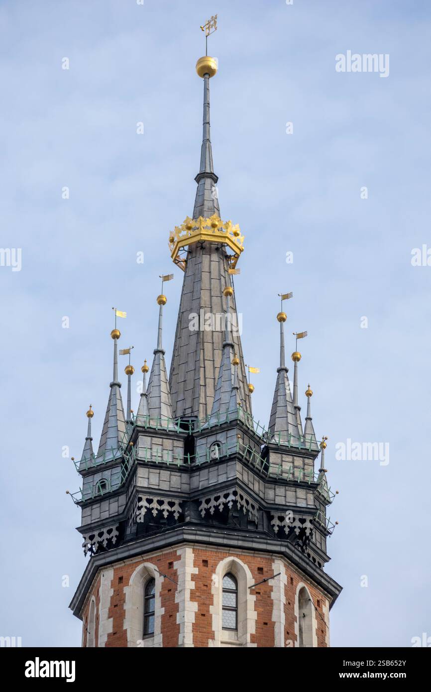 an impressive church tower with a golden spire and decorative elements ...
