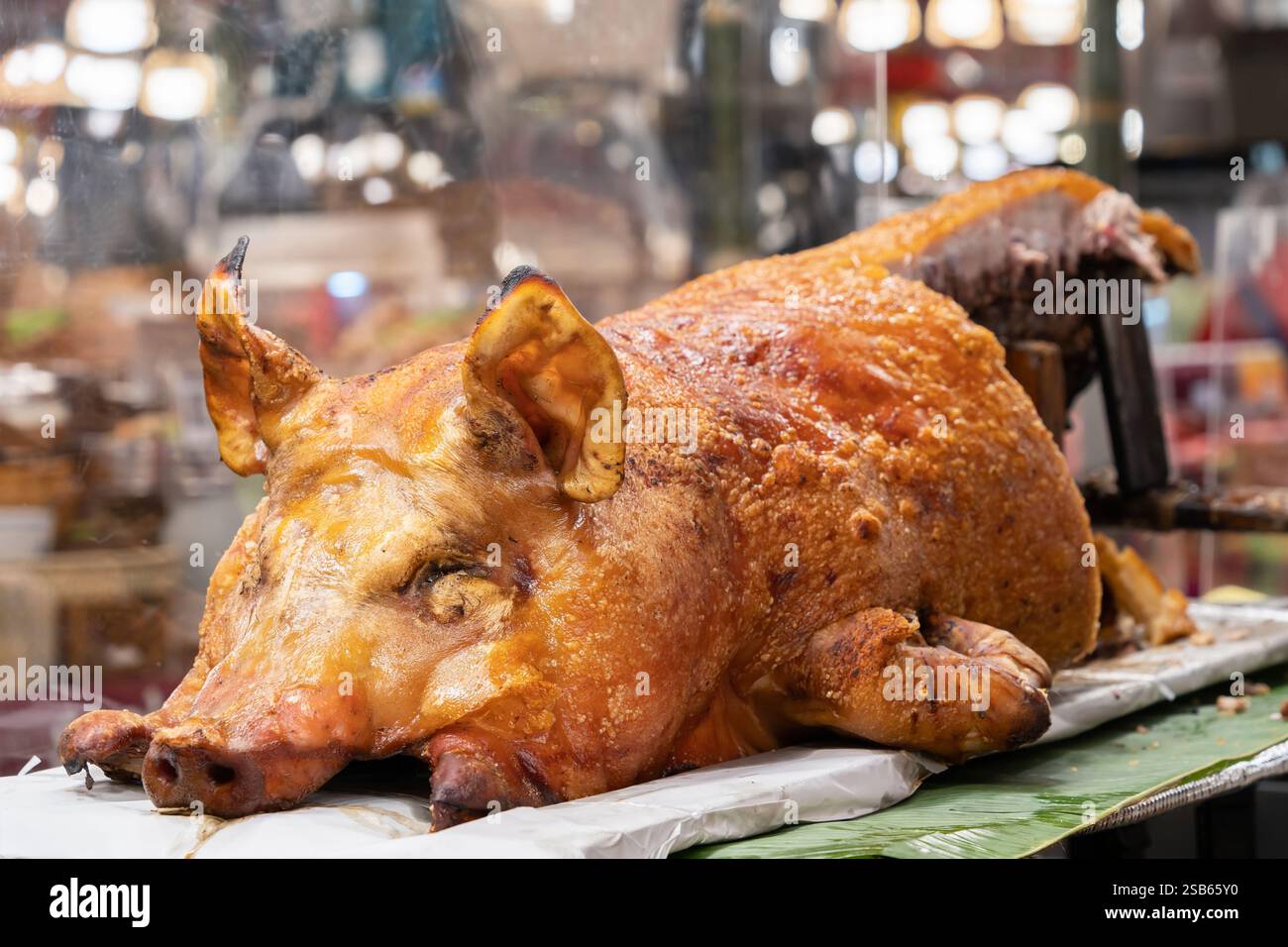 Close-up view of a roasted pork at the food stall Stock Photo - Alamy
