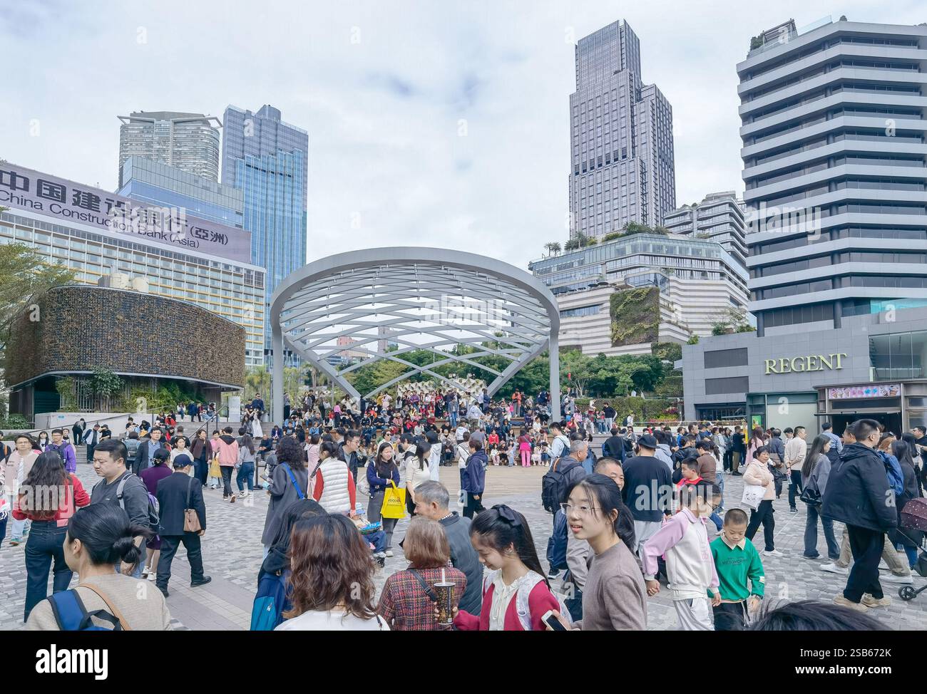 Hong Kong, China - February 01, 2025 : A vibrant crowd enjoys the Tsim ... Hong Kong, China - February 01, 2025 : A vibrant crowd enjoys the Tsim ...
