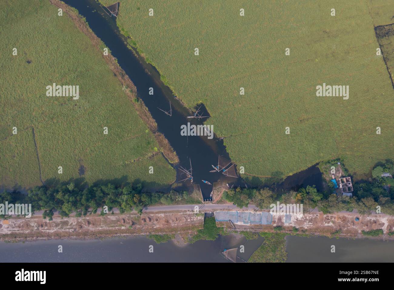 Aerial view of a vast marsh dotted with traditional fishing traps in ...