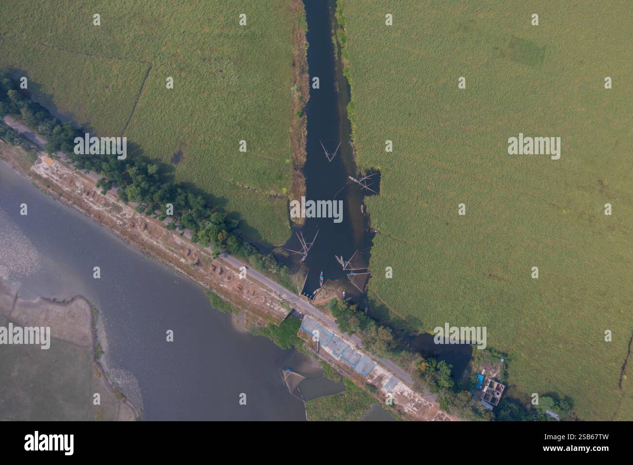 Aerial view of a vast marsh dotted with traditional fishing traps in ...