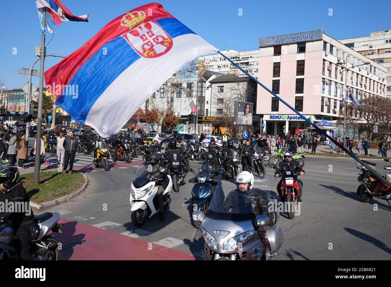 Peopleride their motorcycles during a protest over the collapse of a ...