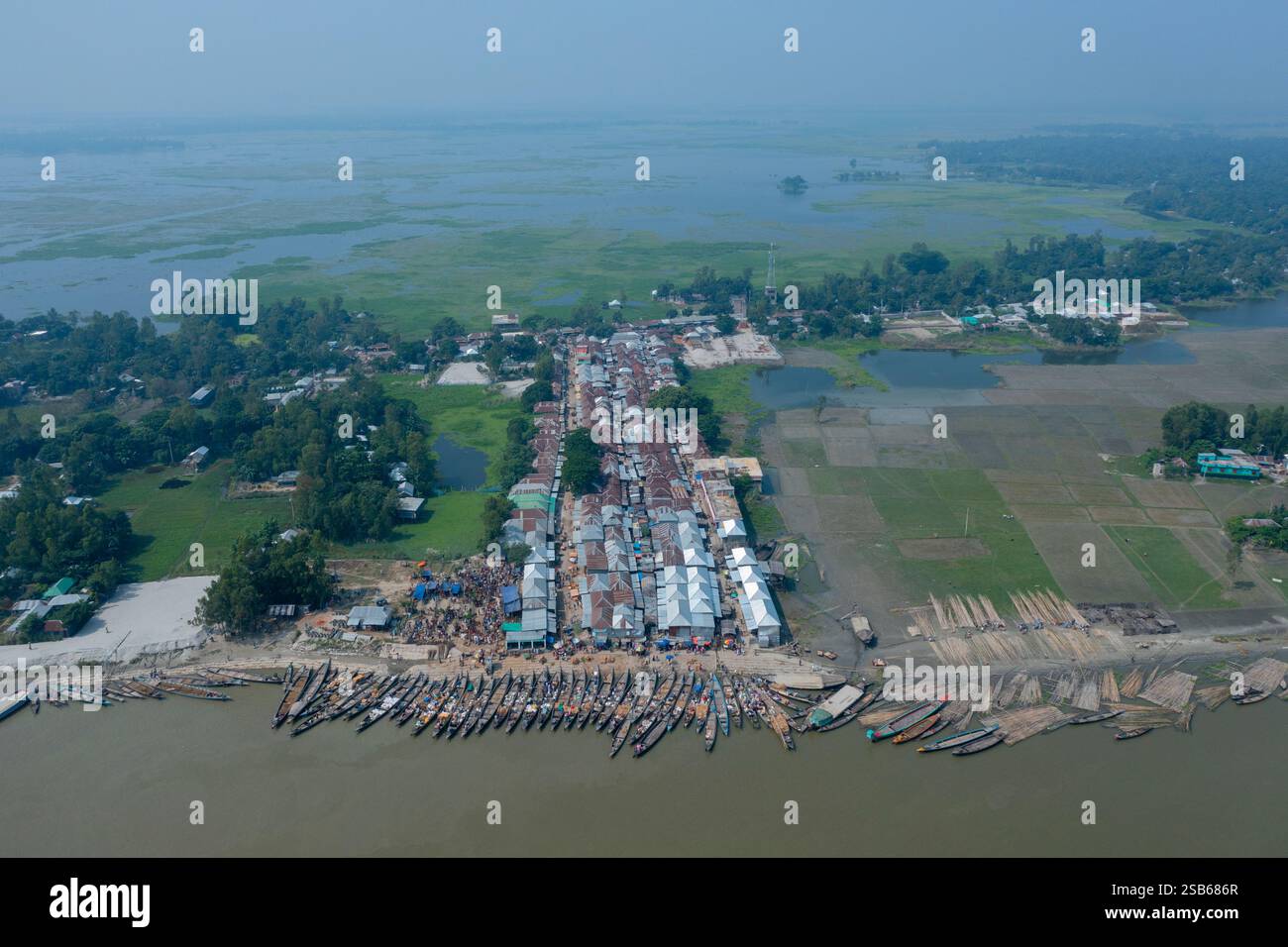 Aerial view of the bustling riverside bazar, Nakalia, with a fleet of ...