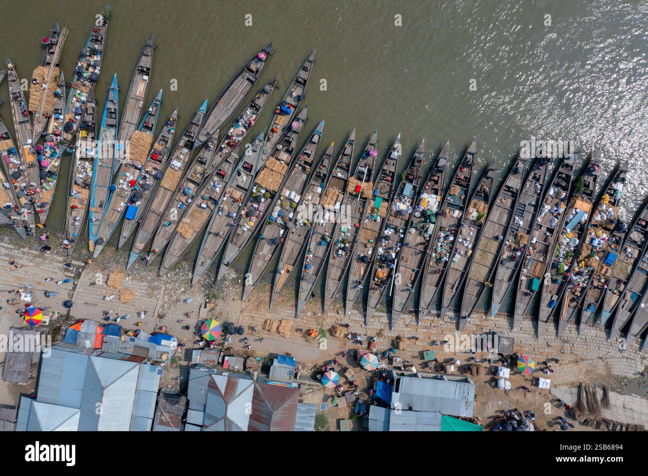 Aerial view of the bustling riverside bazar, Nakalia, with a fleet of ...