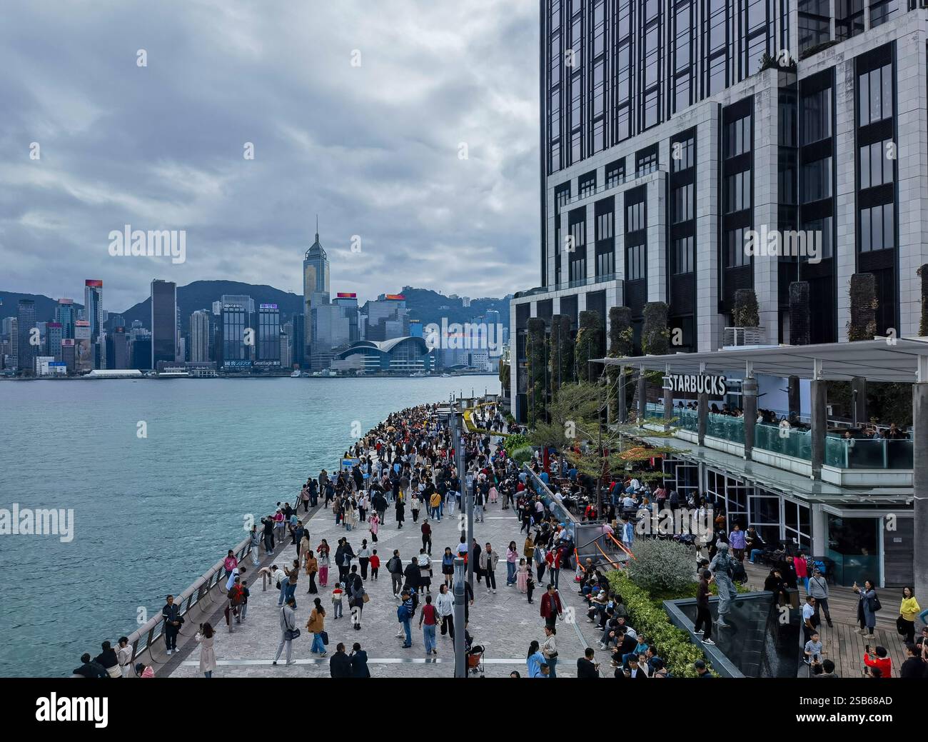 Hong Kong, China - February 01, 2025 : A bustling Tsim Sha Tsui Promenade during Chinese New ...