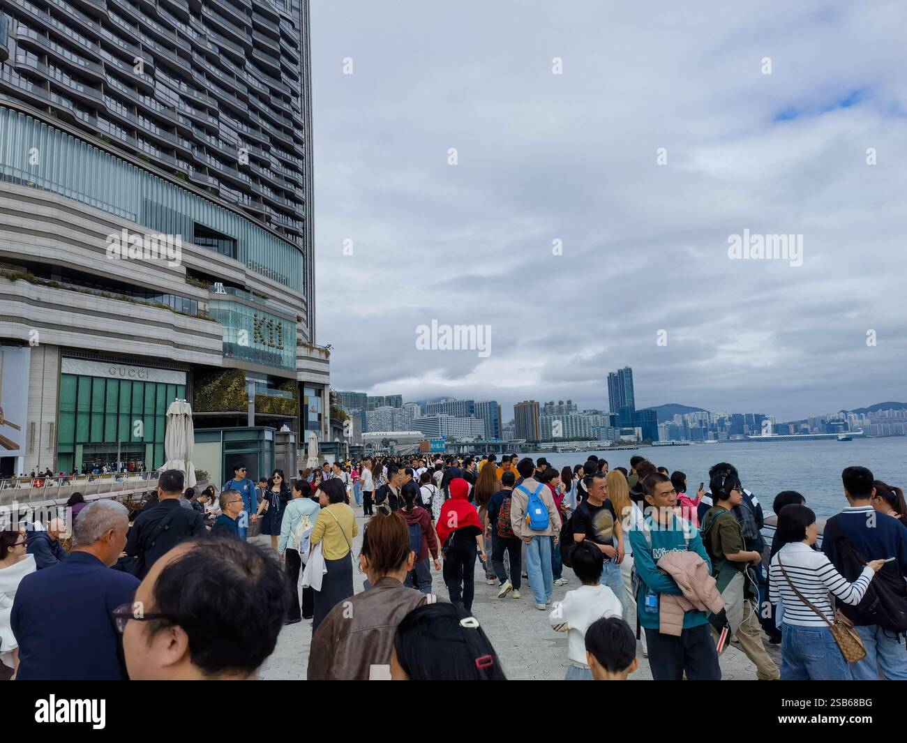 Hong Kong, China - February 01, 2025 : A bustling Tsim Sha Tsui Promenade during Chinese New ...