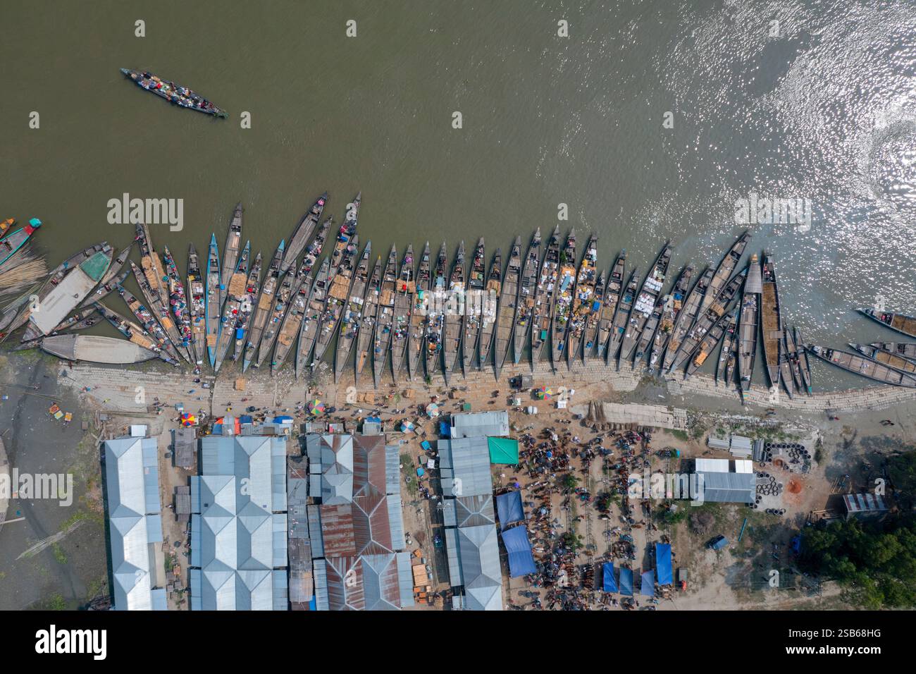 Aerial view of the bustling riverside bazar, Nakalia, with a fleet of ...