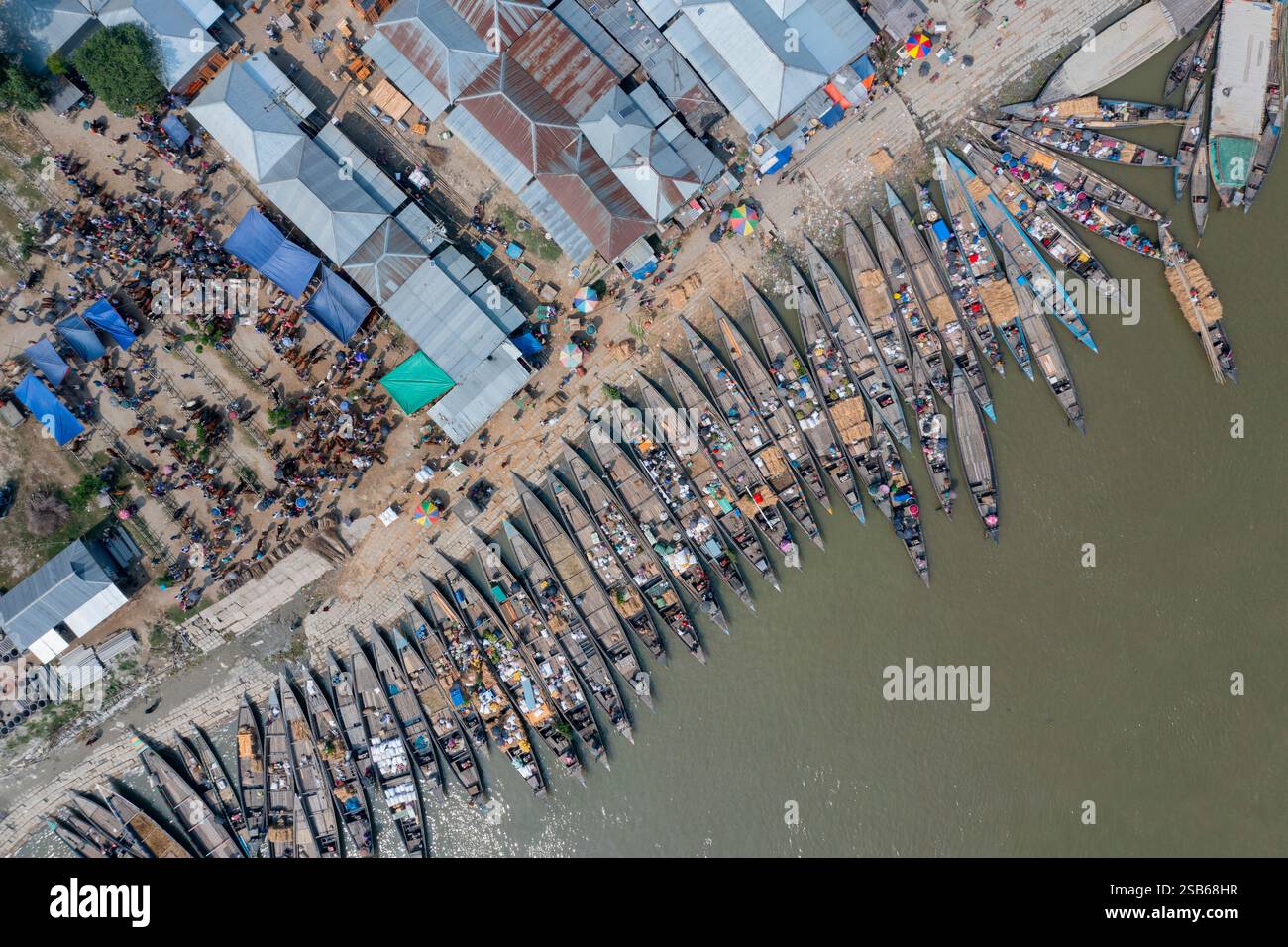 Aerial view of the bustling riverside bazar, Nakalia, with a fleet of ...