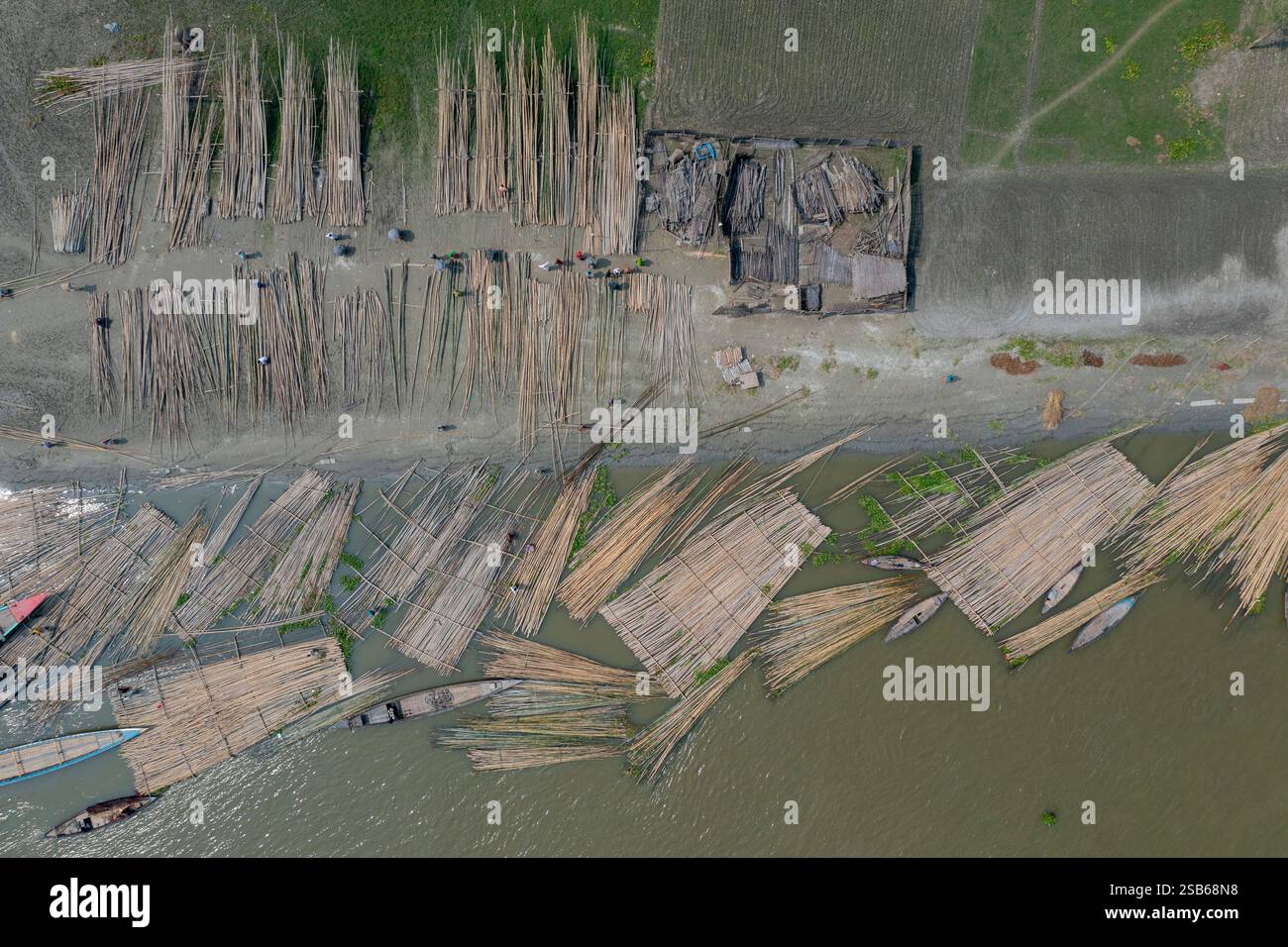 Aerial view of a bustling bamboo market along the banks of the ...