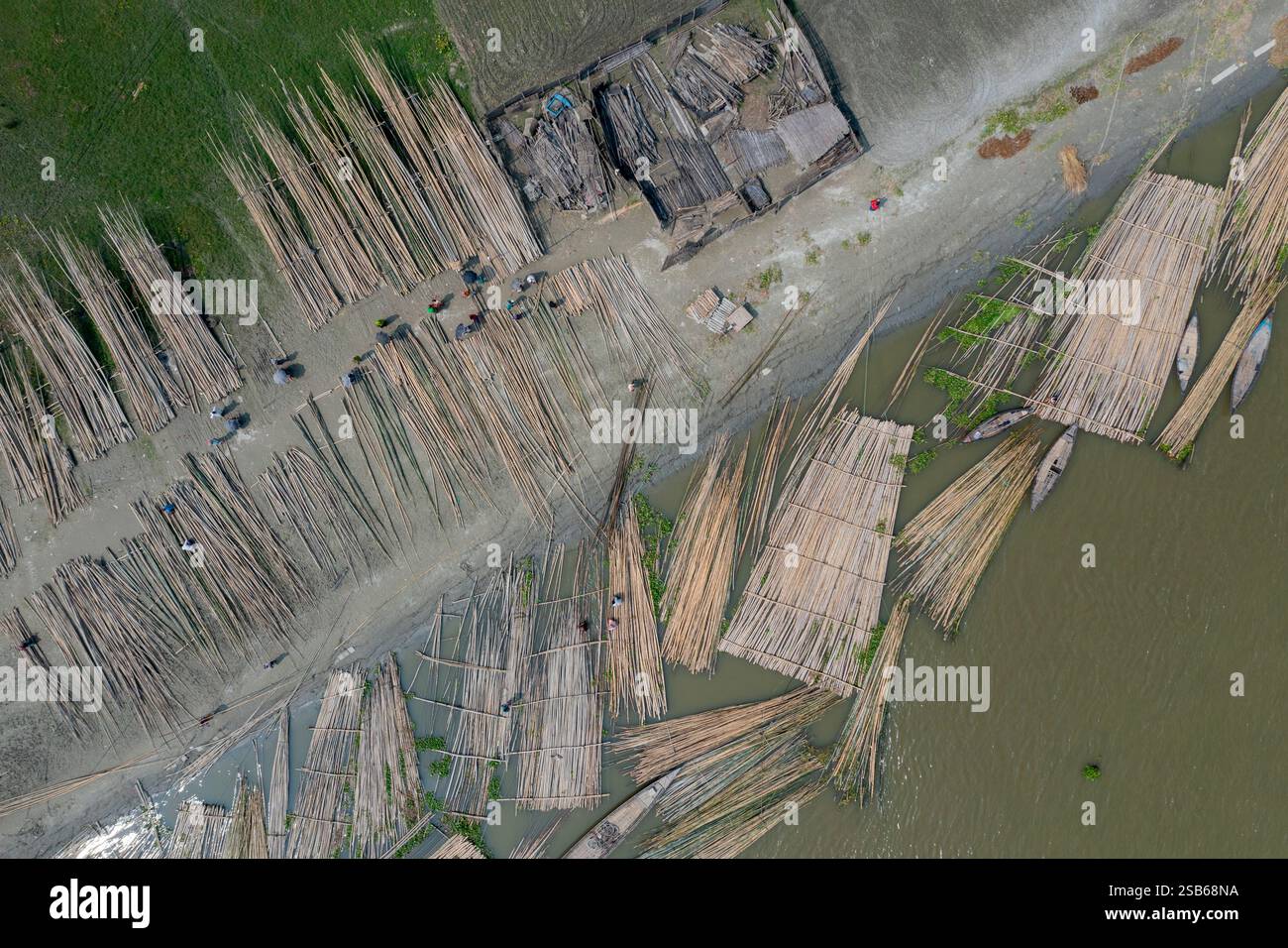 Aerial view of a bustling bamboo market along the banks of the ...