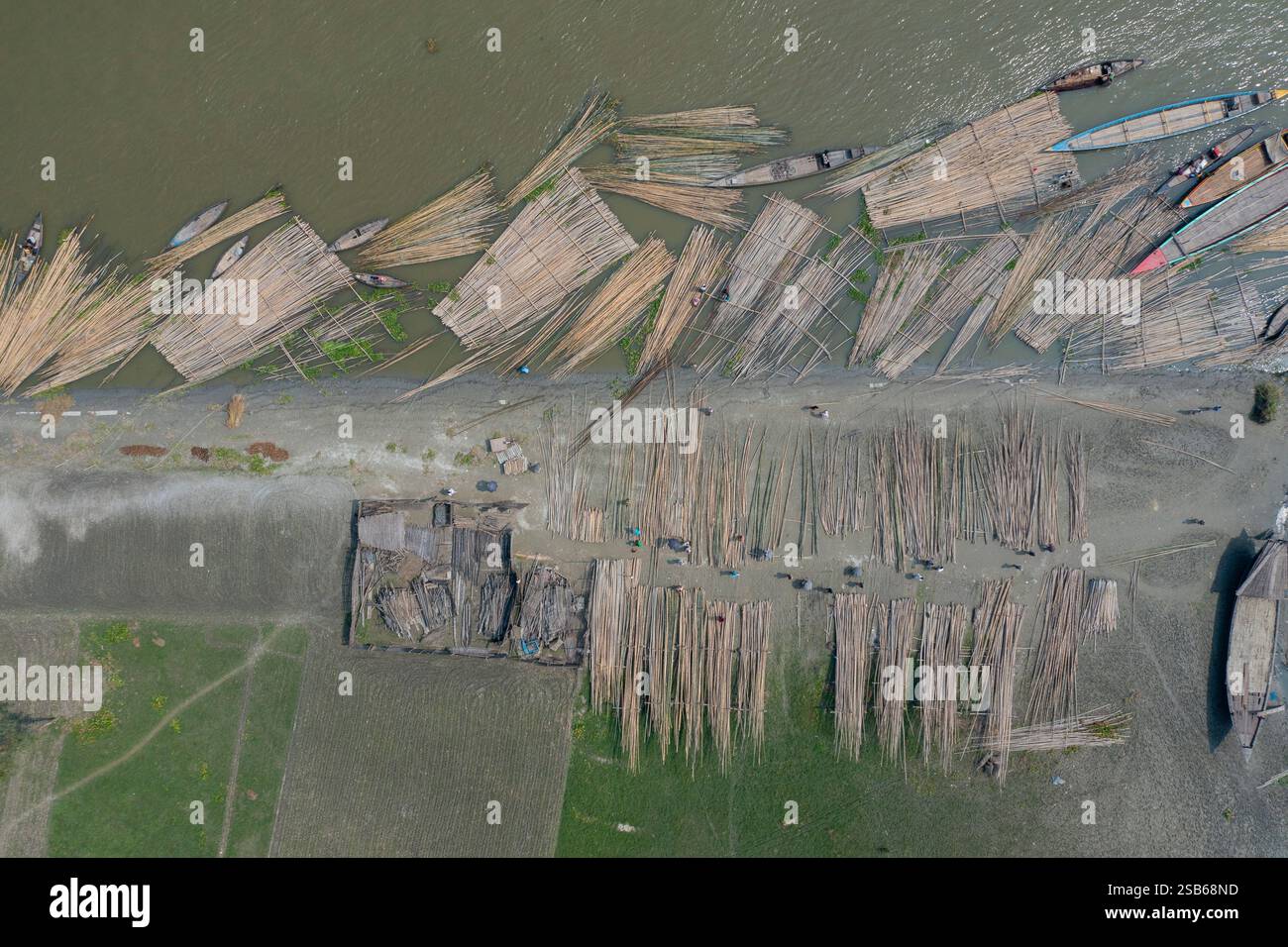Aerial view of a bustling bamboo market along the banks of the ...