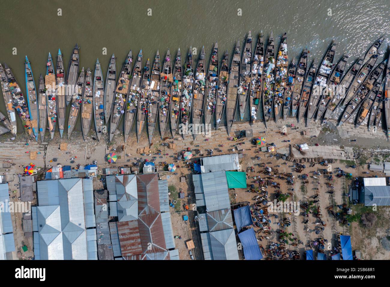 Aerial view of the bustling riverside bazar, Nakalia, with a fleet of ...