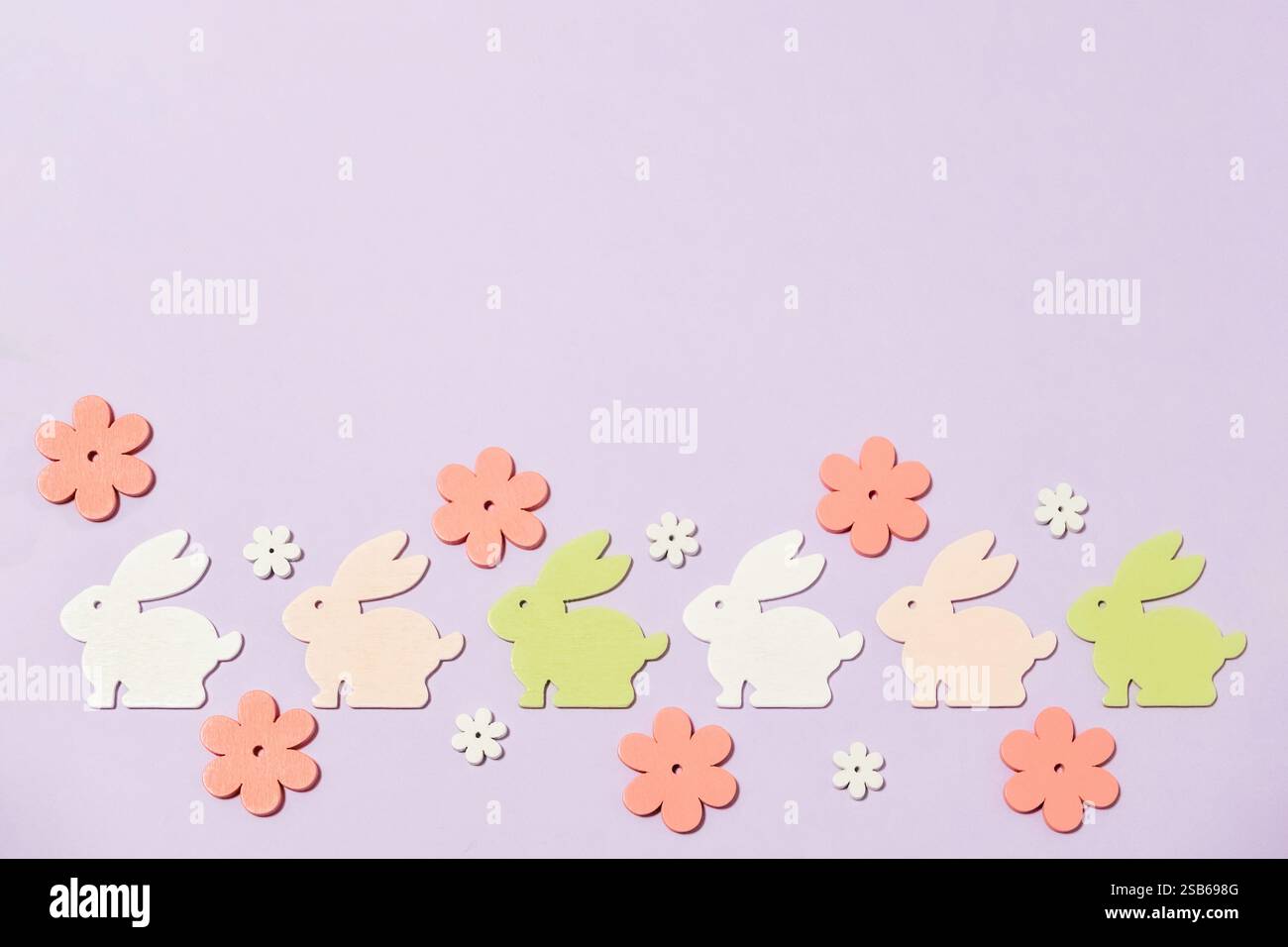 Row of rabbits and flowers on a purple background. The rabbits are in ...
