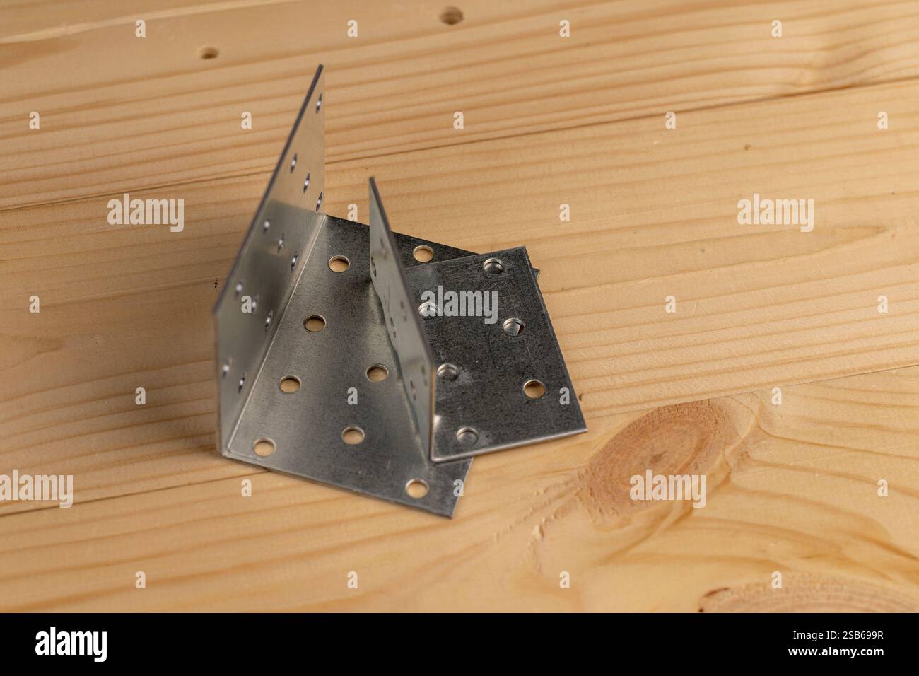 metal corner With a lot of holes for connecting wooden parts with ...