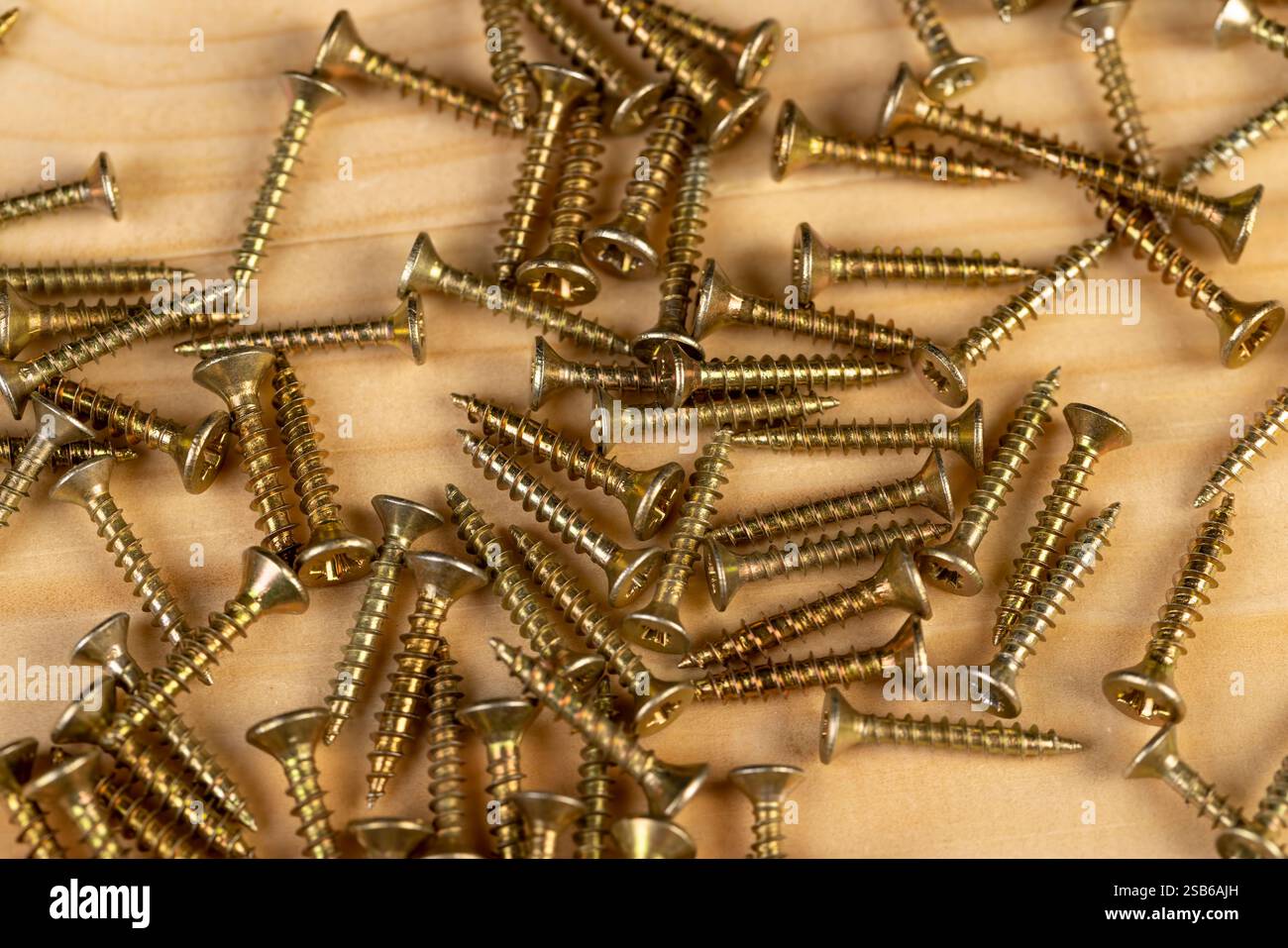 Scattered pile golden metallic screws hi-res stock photography and ...